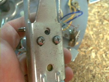 Grab the bracket and hold it in one hand.